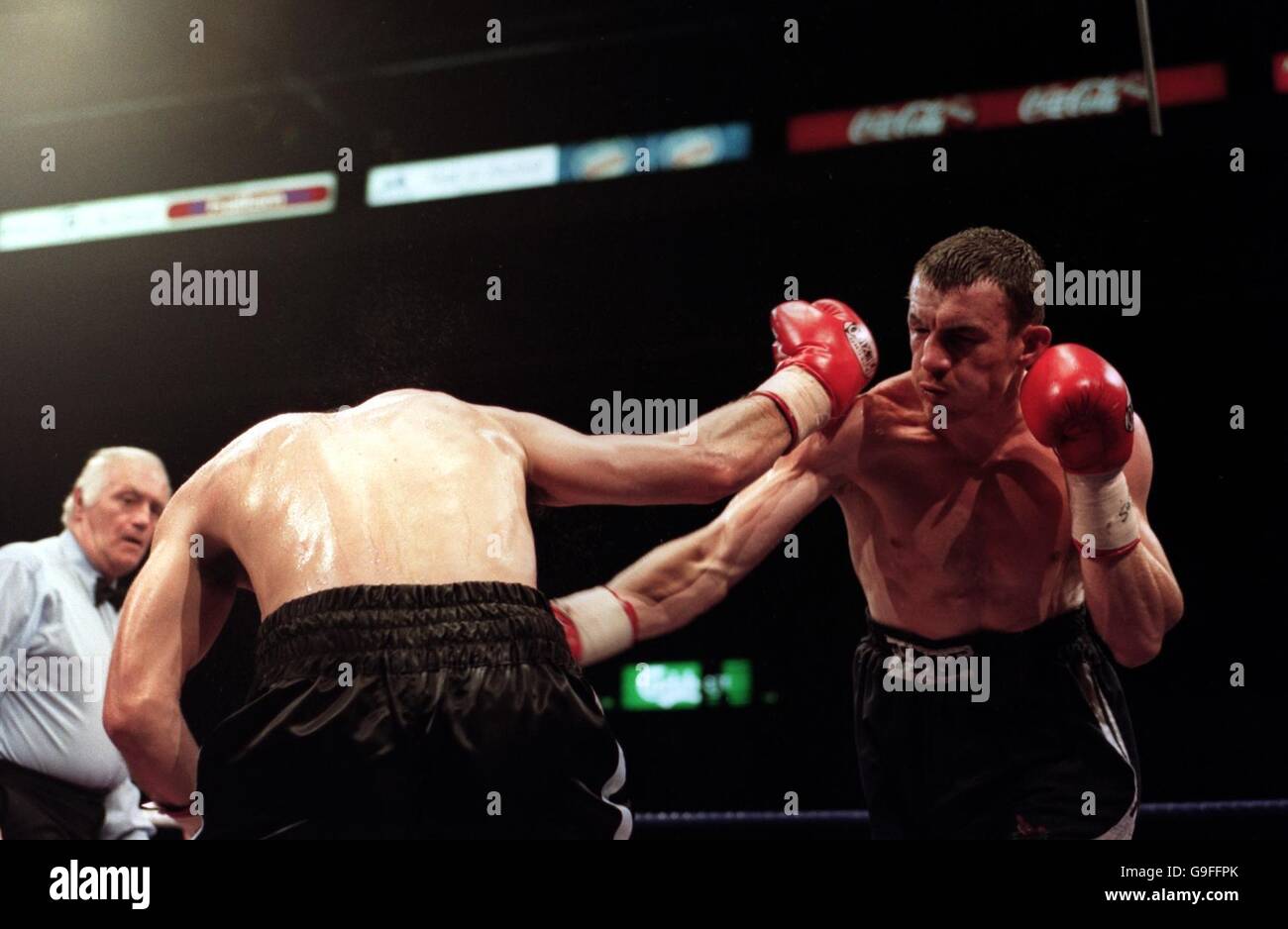 Joe Calzaghe (l) receives a blow to the body on his way to victory over ...