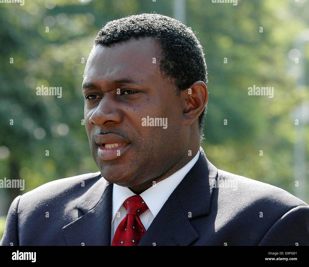 Pastor Michael Simpson speaks to the media at the gates of the public ...