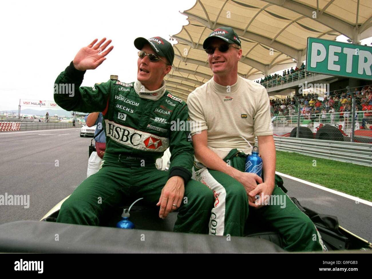 Johnny Herbert and team mate Eddie Irvine in the drivers parade Stock ...