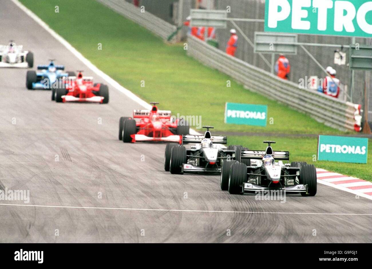 Formula One Motor Racing - Malaysian Grand Prix. Mika Hakkinen leads ...