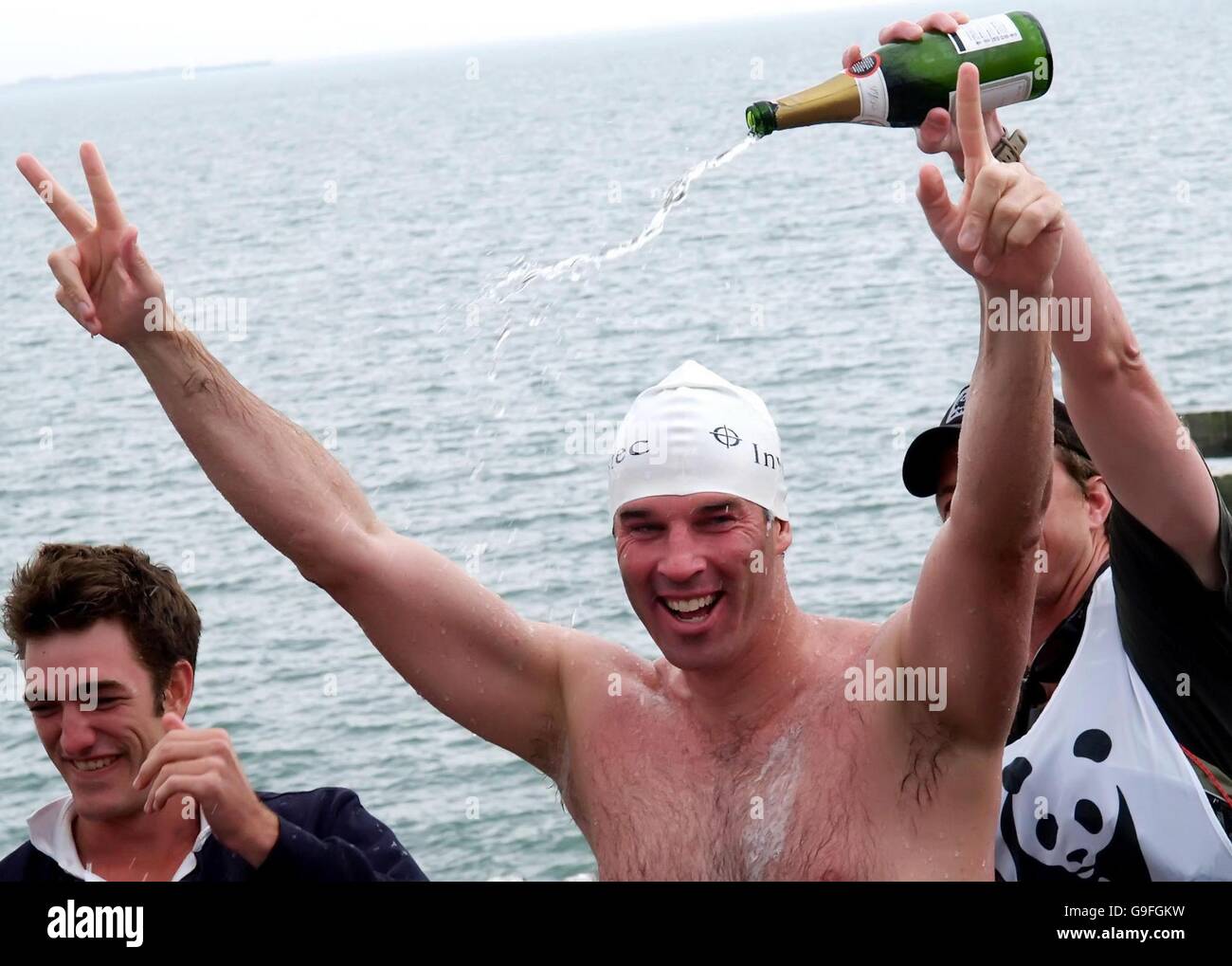 Lewis Pugh, 36, celebrates with champagne near the Thames river at ...