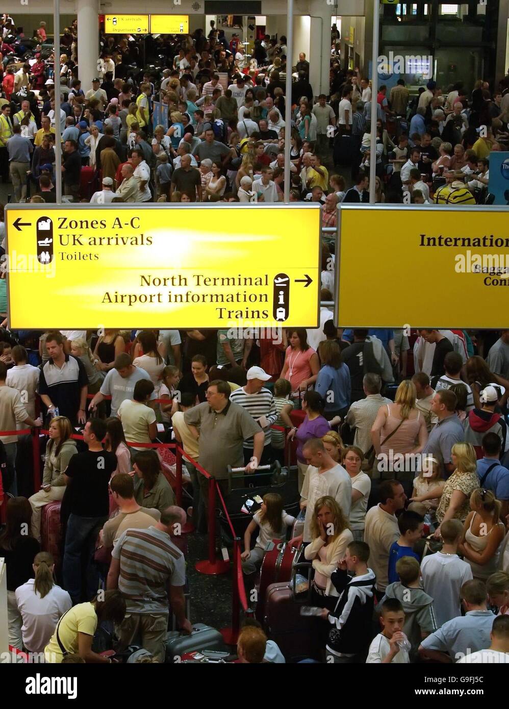 Passengers crowding the departure hall of the Gatwick South Terminal ...