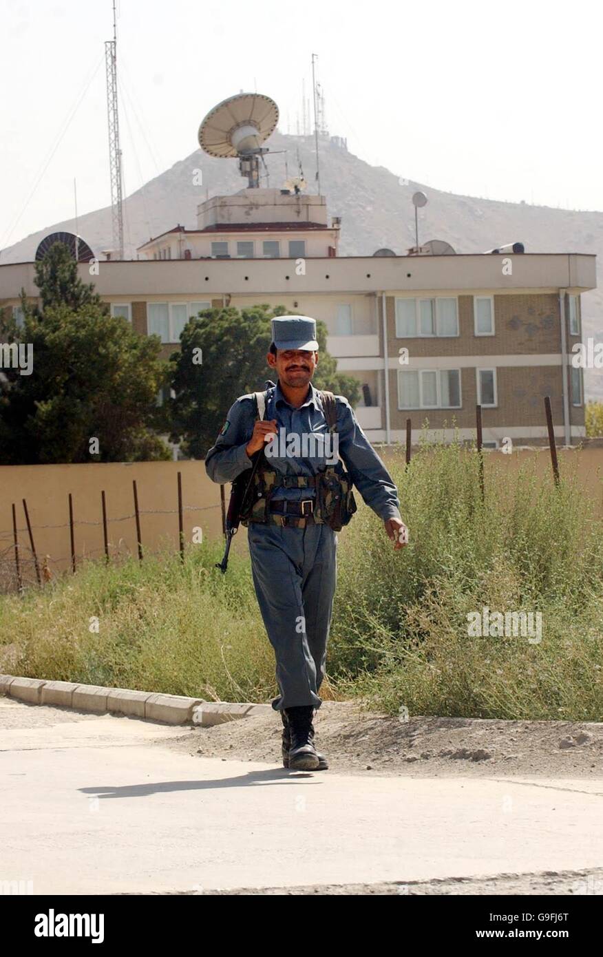 A guard walks in front of the British Embassy in Kabul, Afghanistan ...