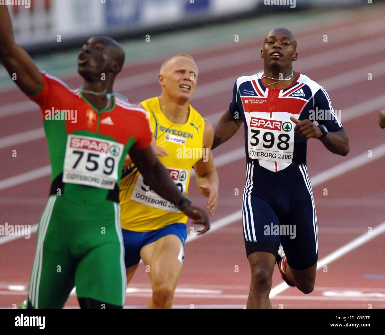 Portugal's Francis Obikwelu (left) celebrates his winning the 200m ...
