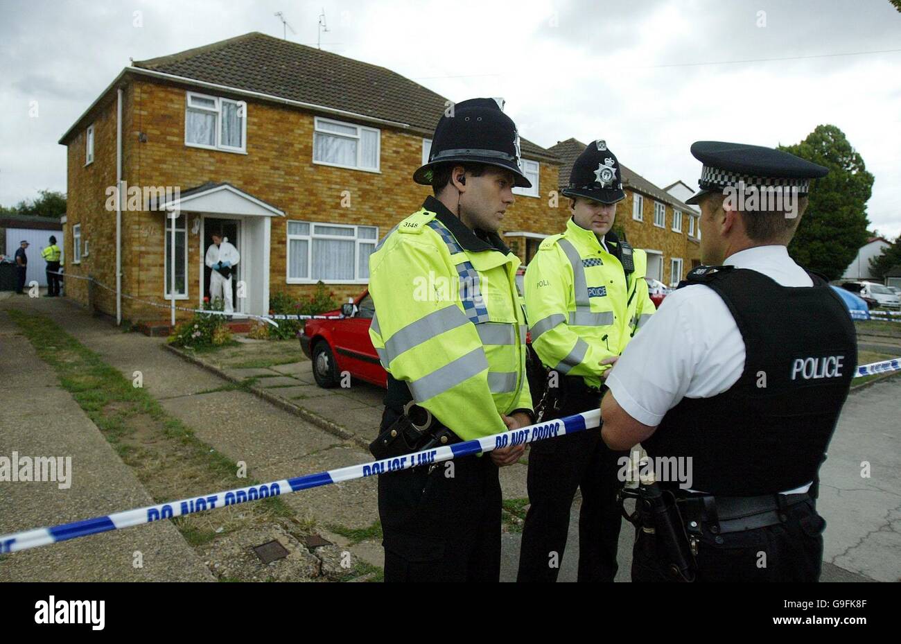 Police officers outside a semi-detached house at Micklefield Road, High ...