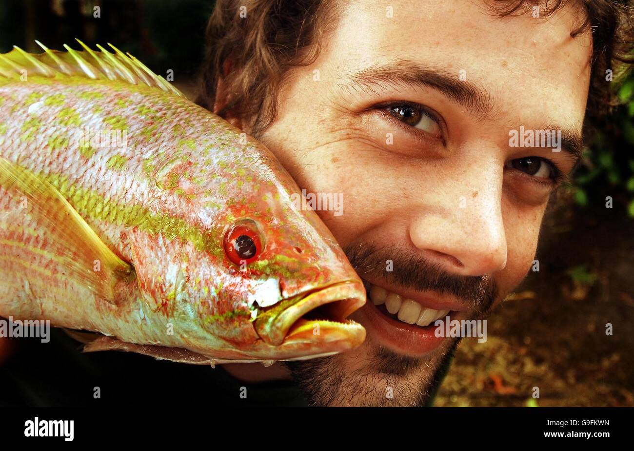 Man auctions slap in face with wet fish Stock Photo - Alamy