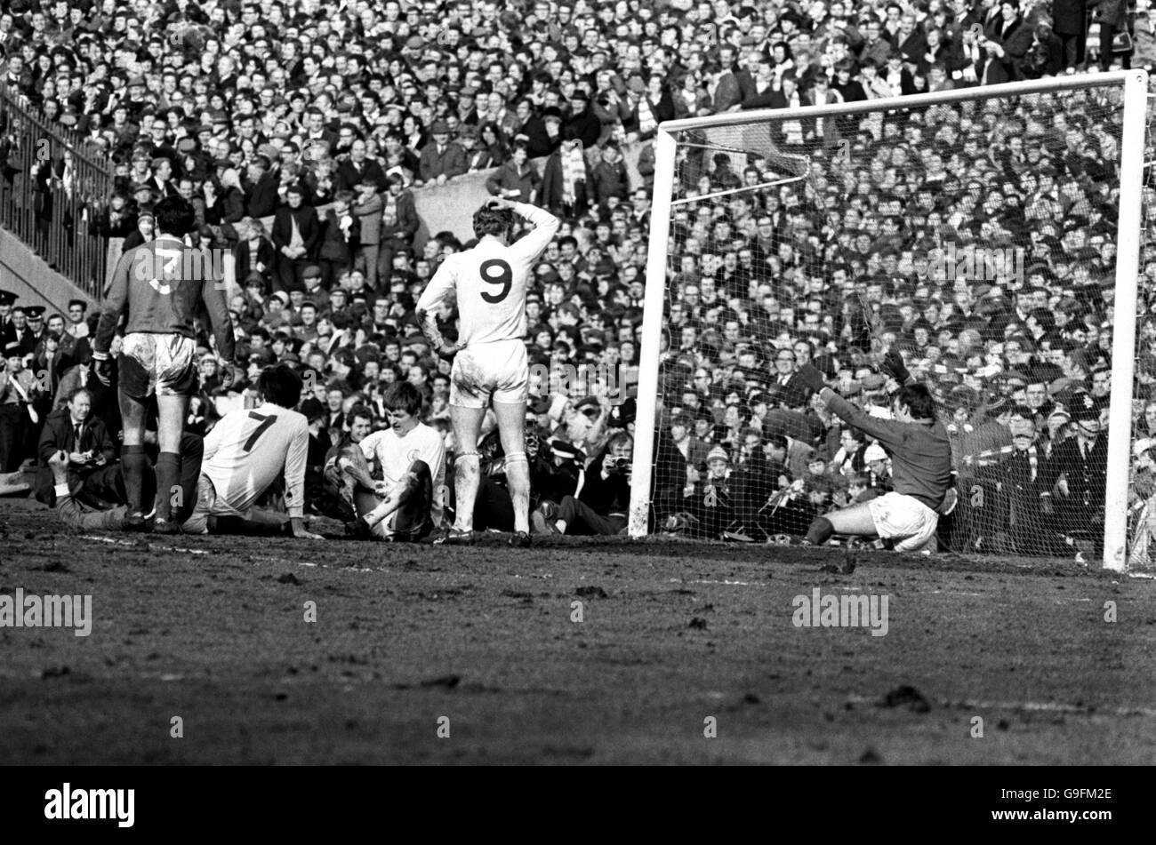 Manchester United goalkeeper Alex Stepney (r) picks himself up as ...