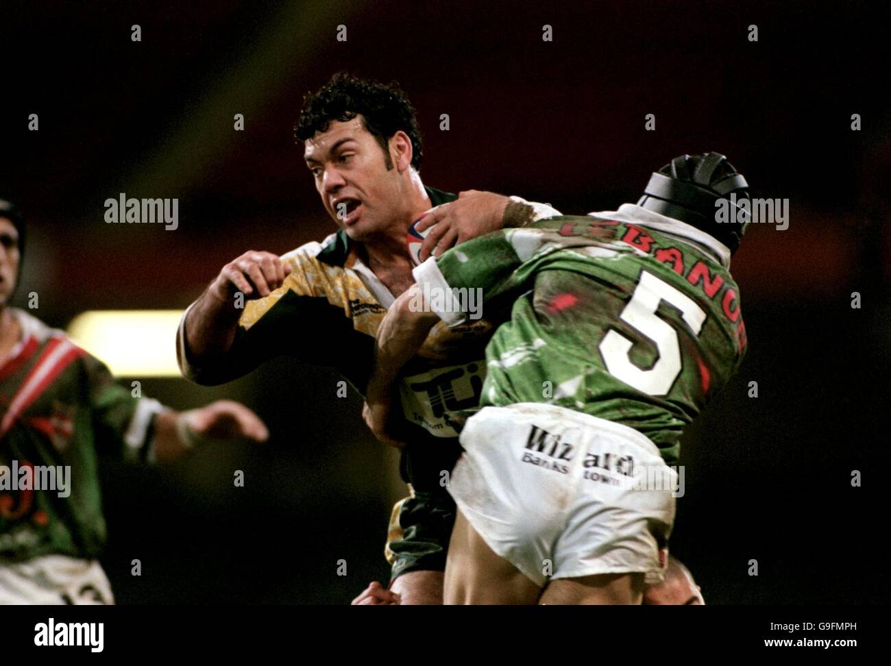 Cook islands kevin iro is tackled by lebanons travis touma hi-res stock ...