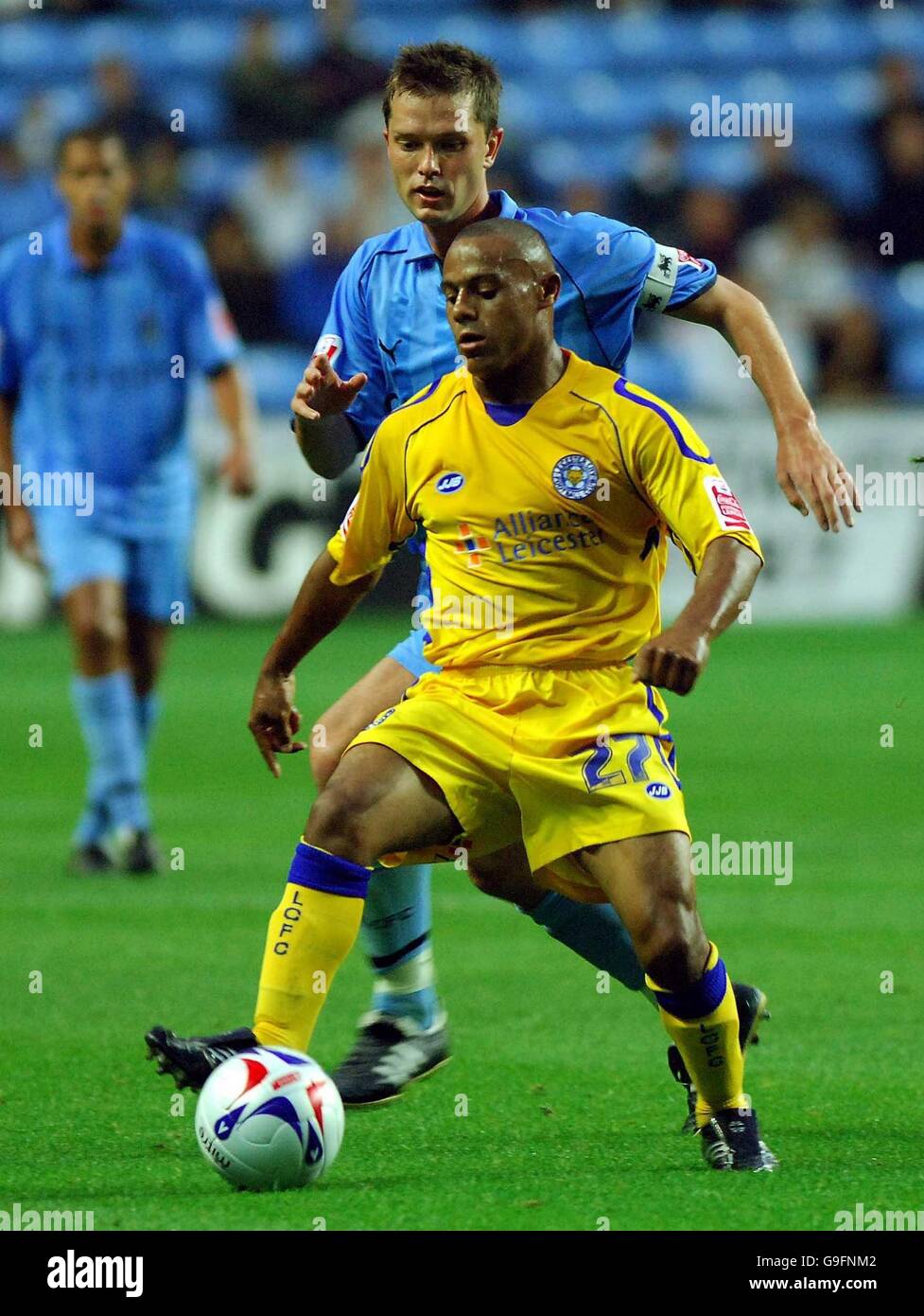 Coventry captain Stephen Hughes, (background) shuts down Leicester's ...