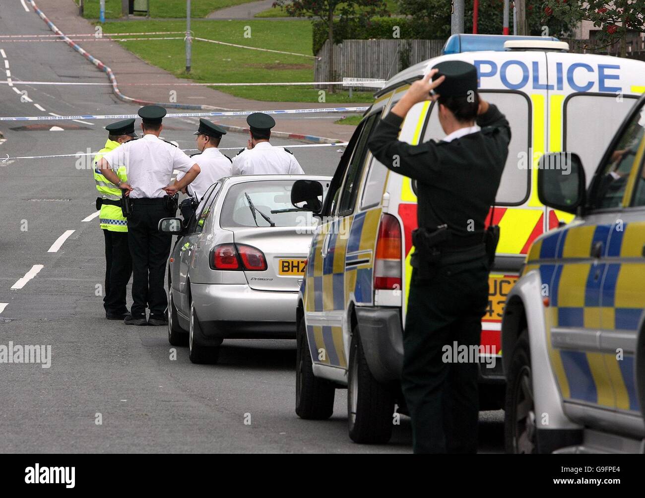 Police standing by a sealed-off an area in the Kilcooley estate in ...