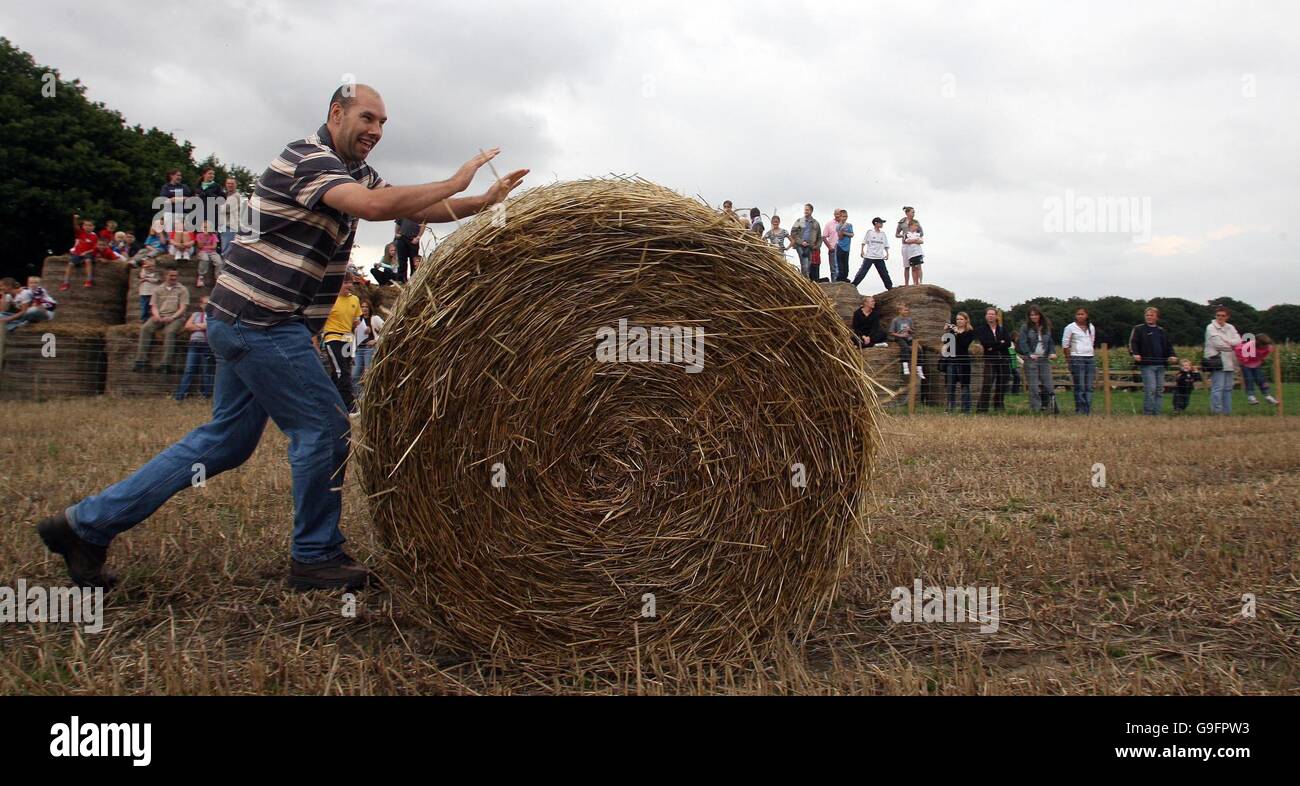 Ian Scott takes part in the first annual straw bale rolling competition ...