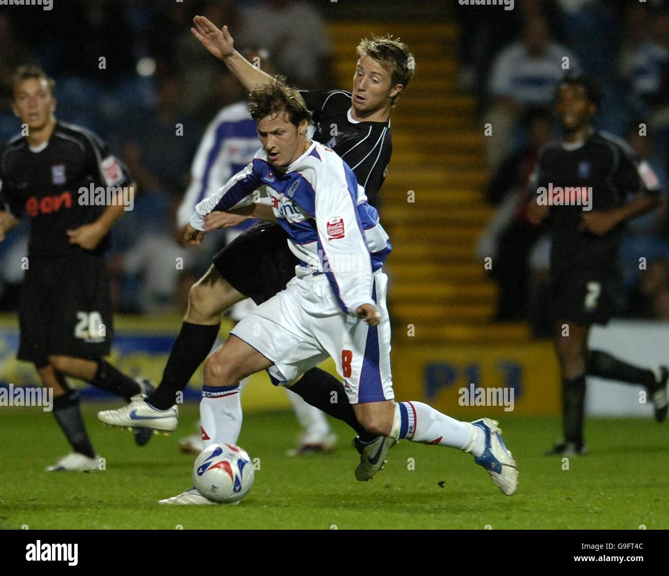 QPR's Marc Bircham (front) and Ipswich's Dean Bowditch during the Coca ...