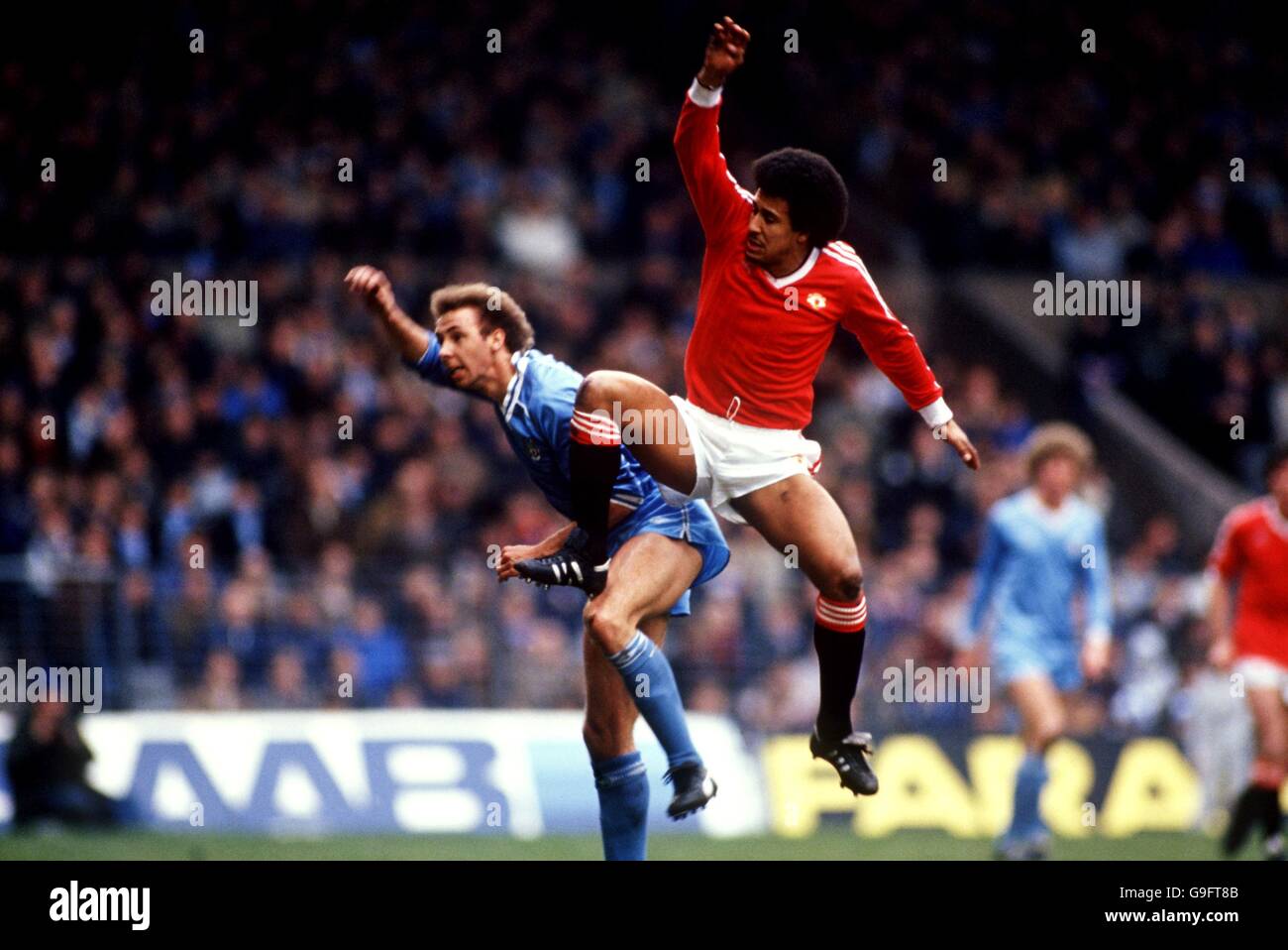 Manchester United's Remi Moses (r) challenges Manchester City's Graham ...