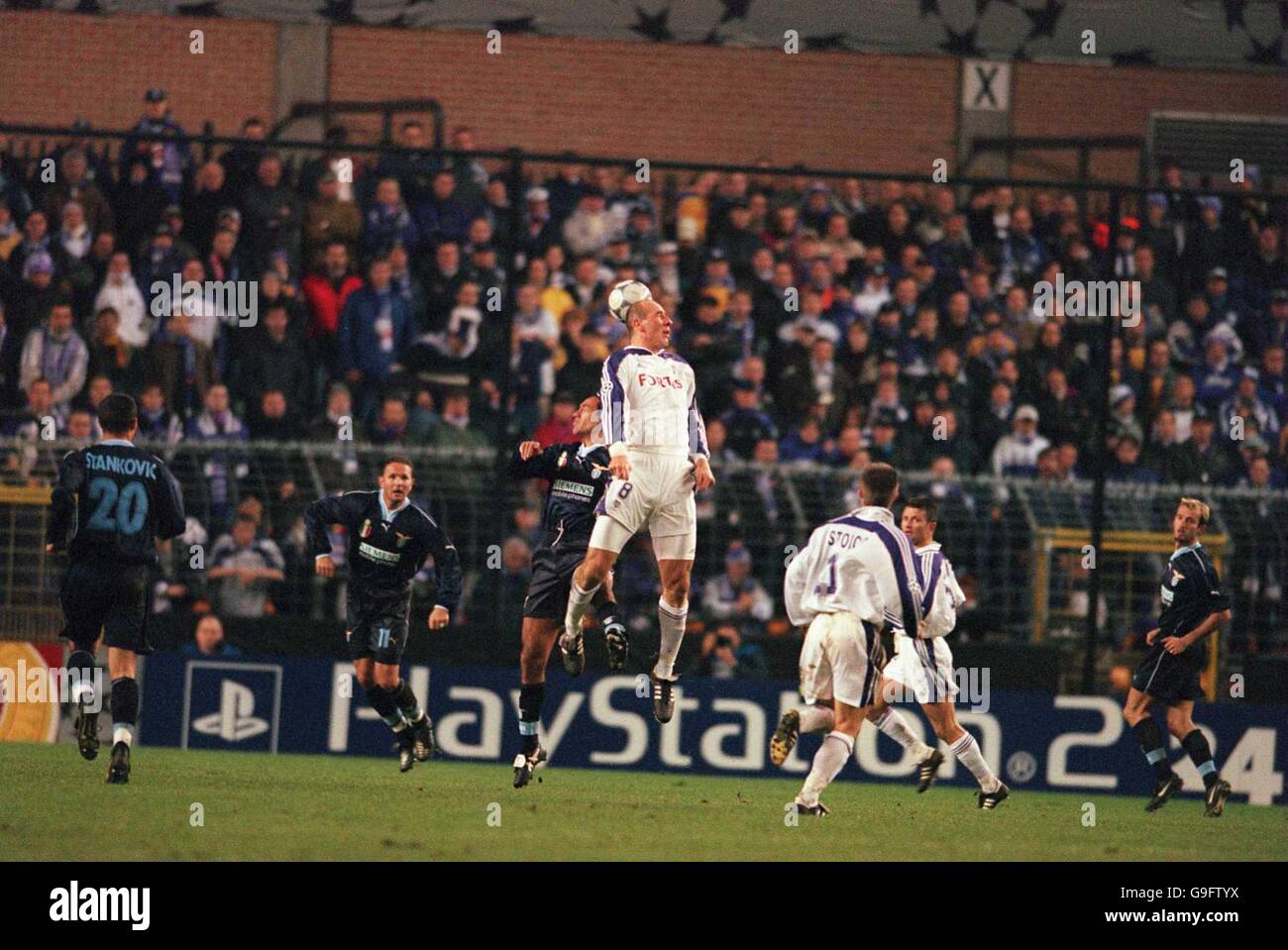 Anderlecht's Jan Koller (r) jumps for a header with Lazio's Alessandro ...