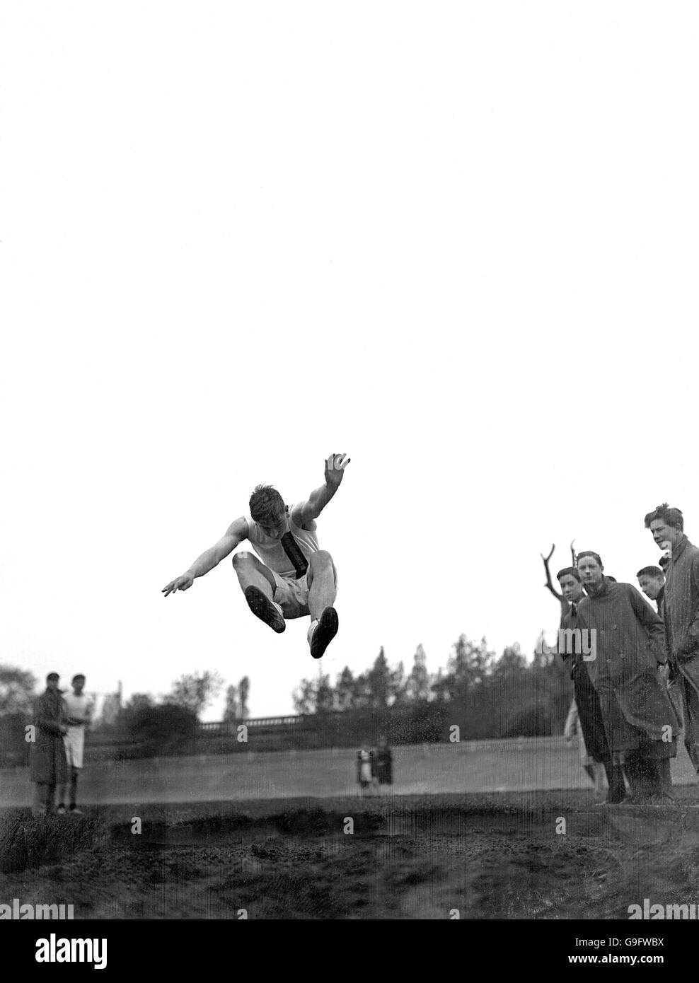 Athletics. Long jump action c.1930 Stock Photo - Alamy