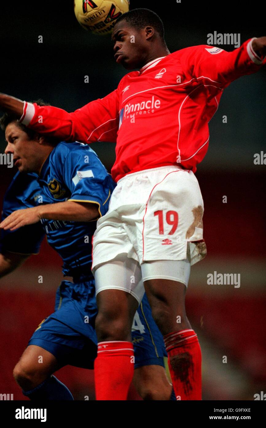 Nottingham Forest's Marlon Harewood (r) leaps above Portsmouth's Scott ...