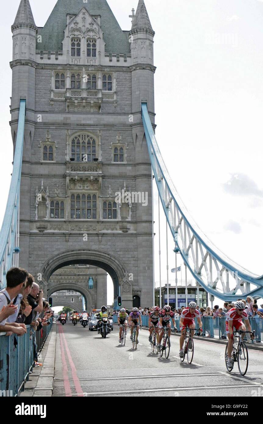Riders pass over Tower Bridge during the final stage of The Tour of ...