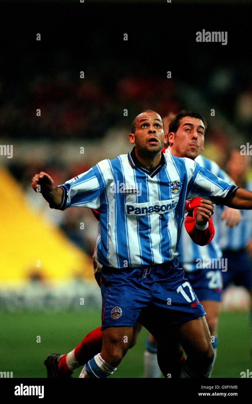 Nottingham Forest's Gary Jones (hidden) puts Huddersfield Town's Simon ...