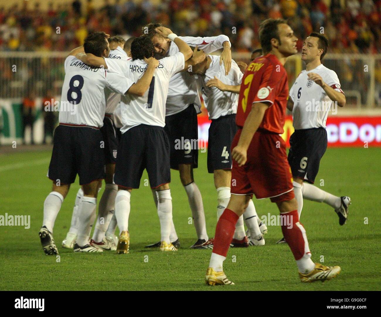 England's Peter Crouch celebrates with team-mates after scoring against ...