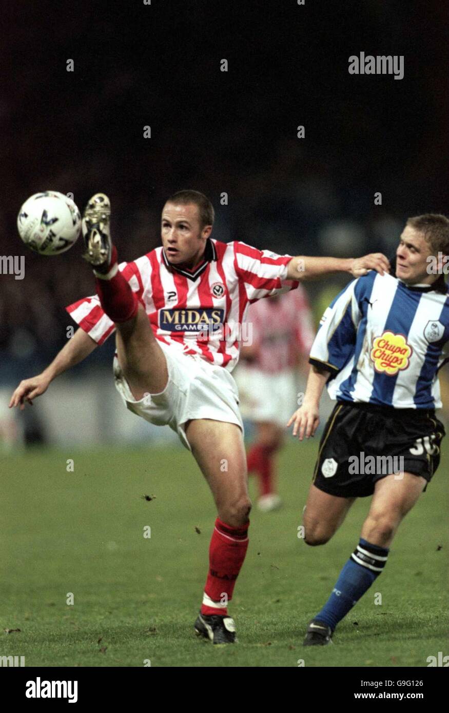 Sheffield United's Paul Devlin (l) controls the ball skilfully and ...