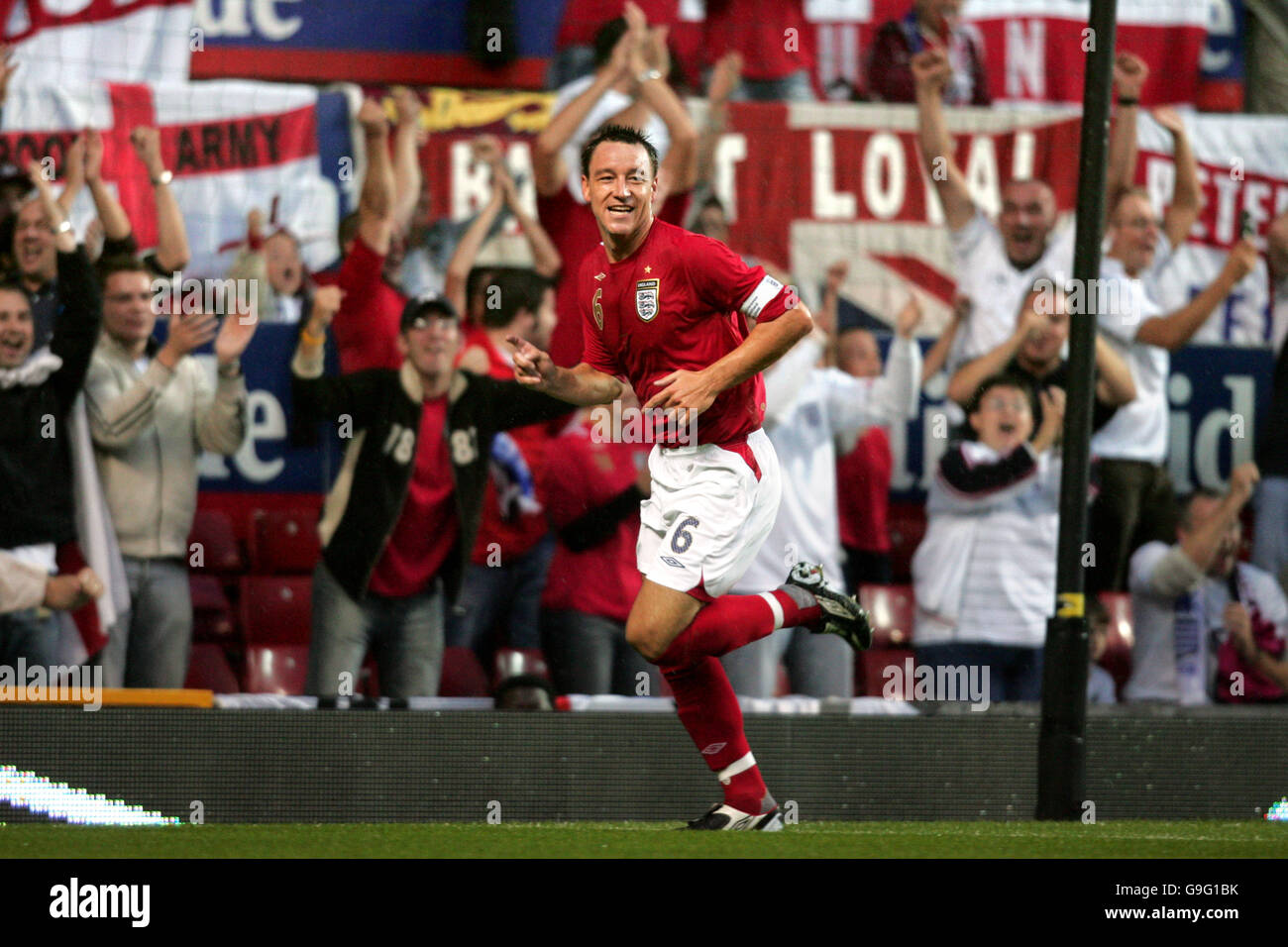 England captain John Terry celebrates scoring during the friendly ...