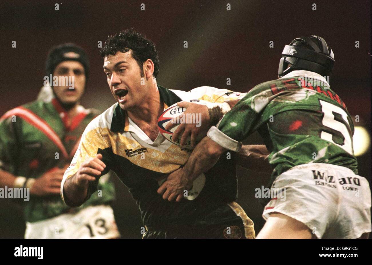 Cook islands kevin iro is tackled by lebanons travis touma hi-res stock ...