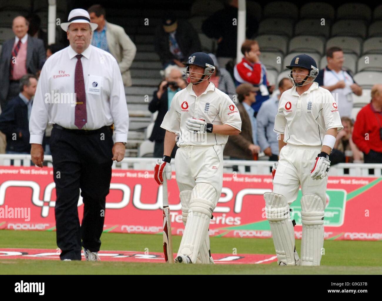 England batsman Ian Bell and Paul Collingwood (centre) look on as ...