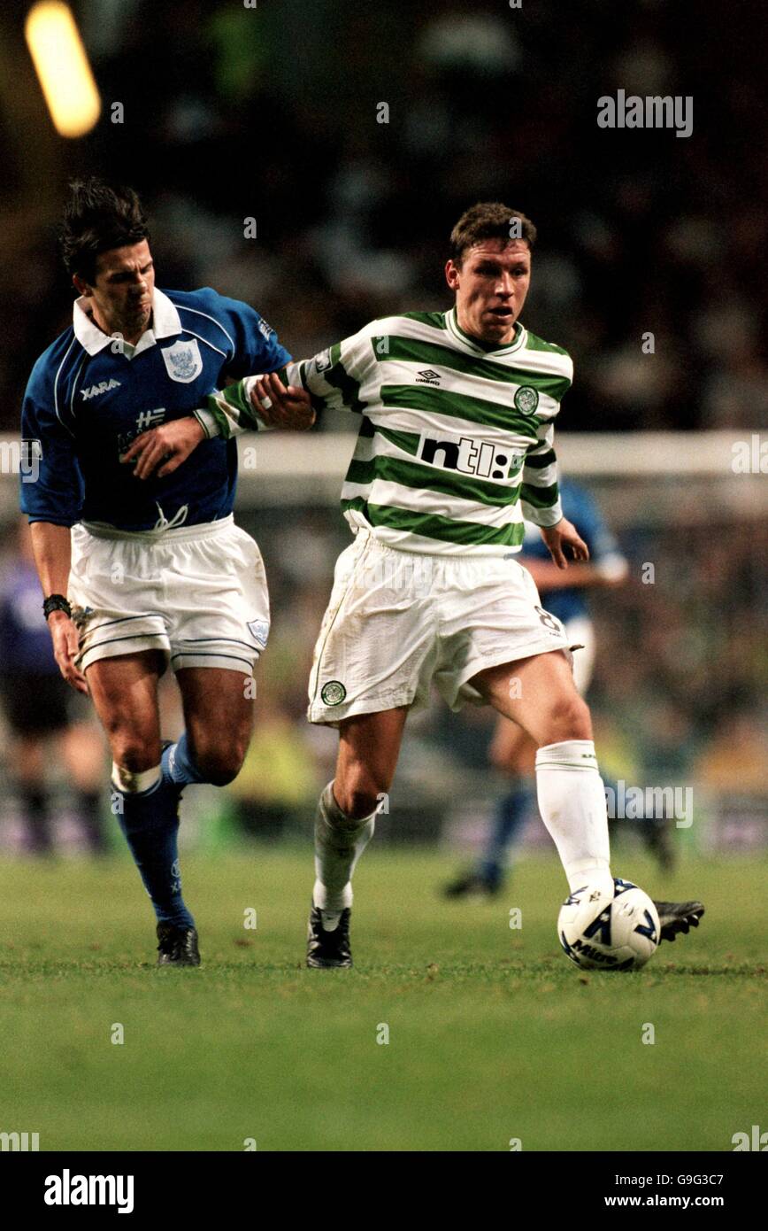 Nic Dasovic of St Johnstone (l) tries to hold back the advancing Alan ...