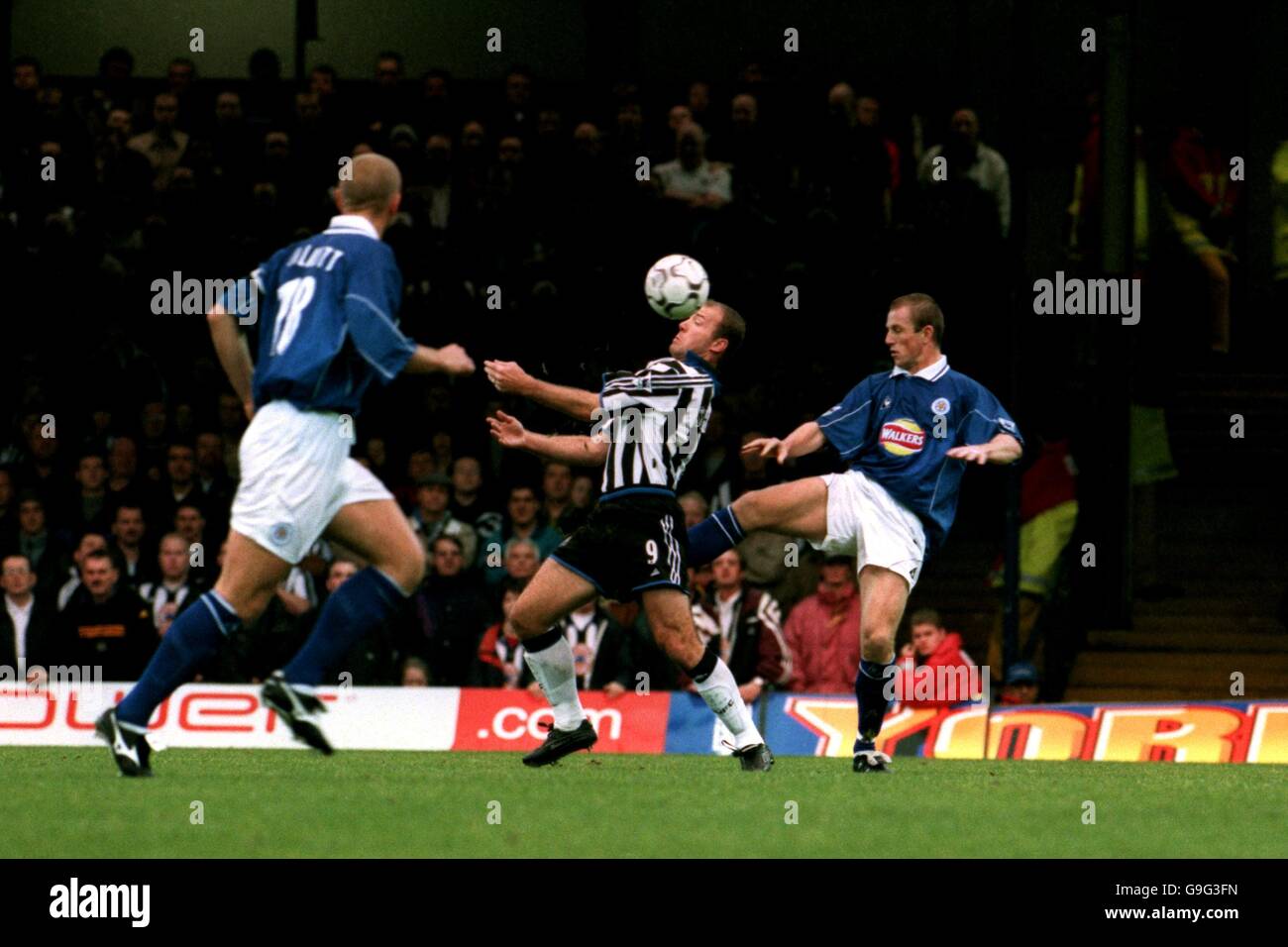 Newcastle United's Alan Shearer (l) brings the ball down under pressure ...
