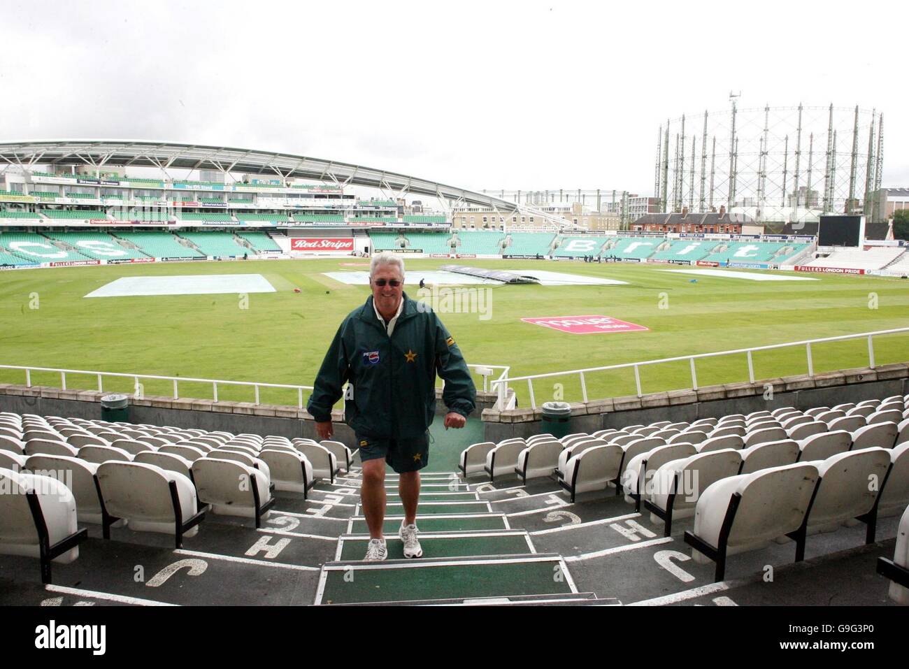 Pakistan cricket coach Bob Woolmer walks up the steps of the pavillion ...