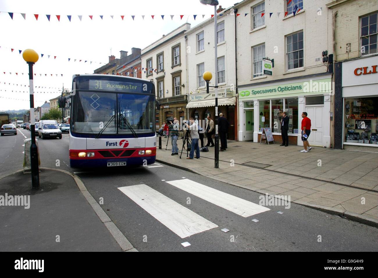 The number 31 bus pulls away from the stop in Bridport, Dorset, where ...