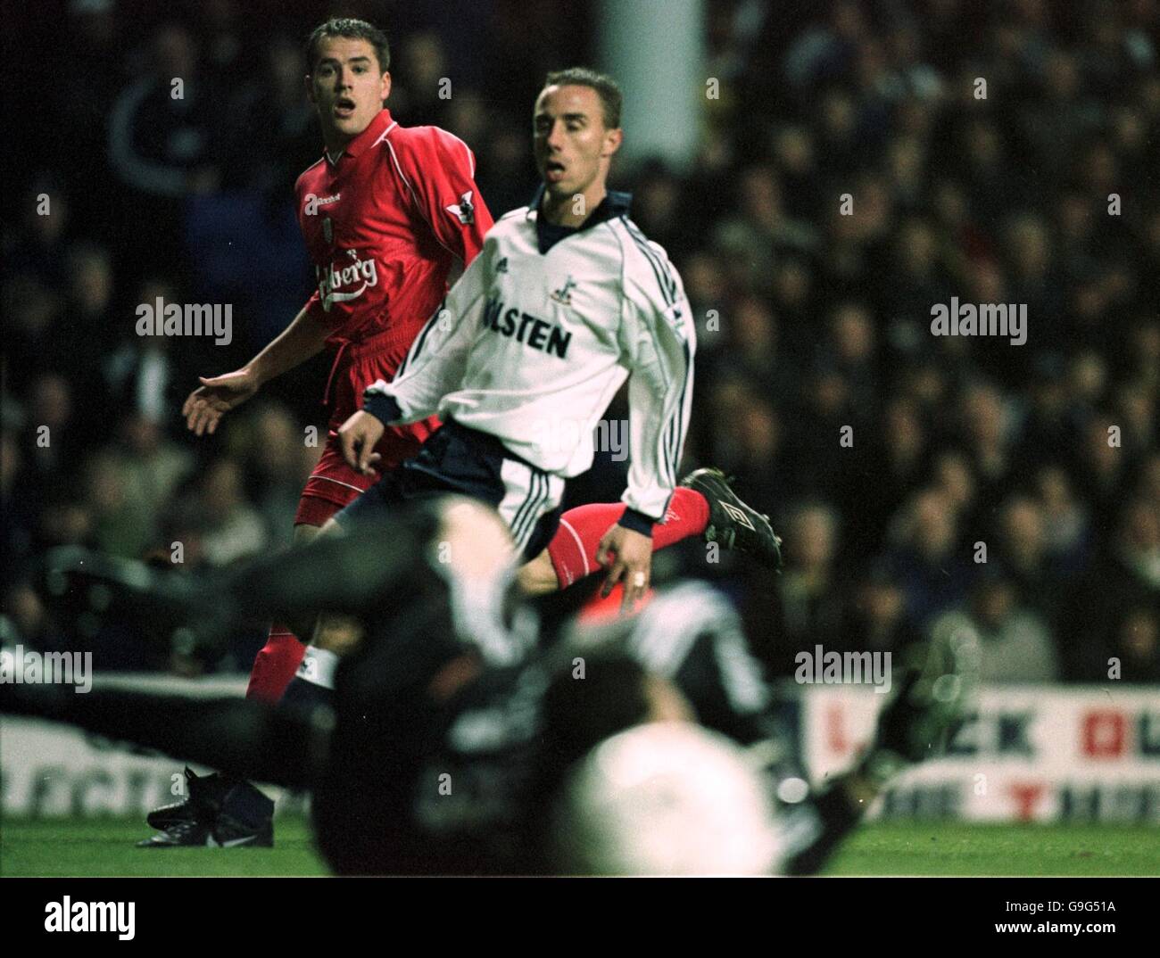 Liverpool's Michael Owen shoots at goal but Tottenham keeper Neil ...