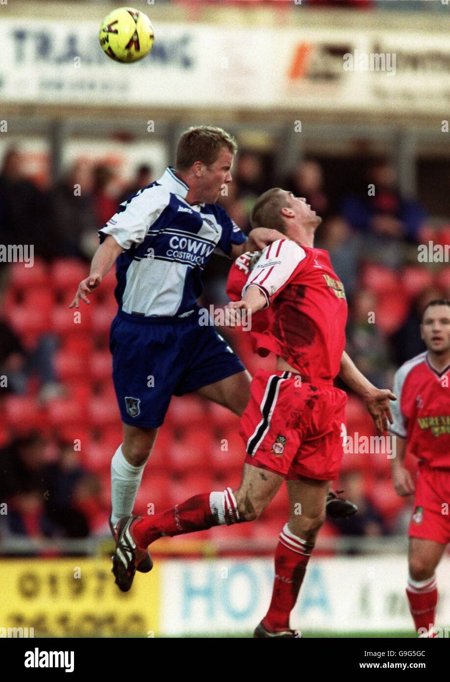 (L-R) Bristol Rovers' Scott Jones is beaten to a header by Wrexham's ...