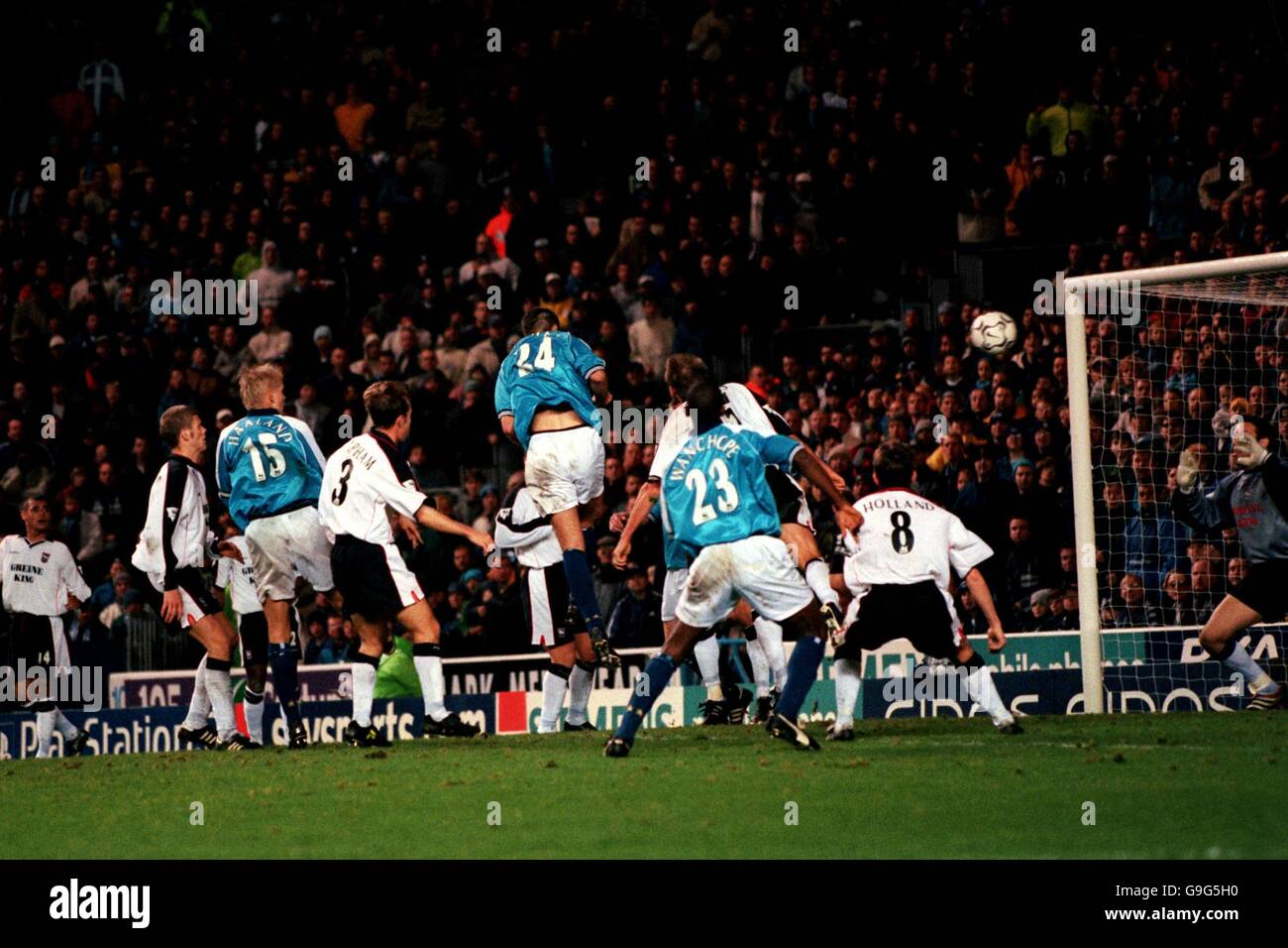Manchester City's Steve Howey (c) scores his team's second goal to pull ...