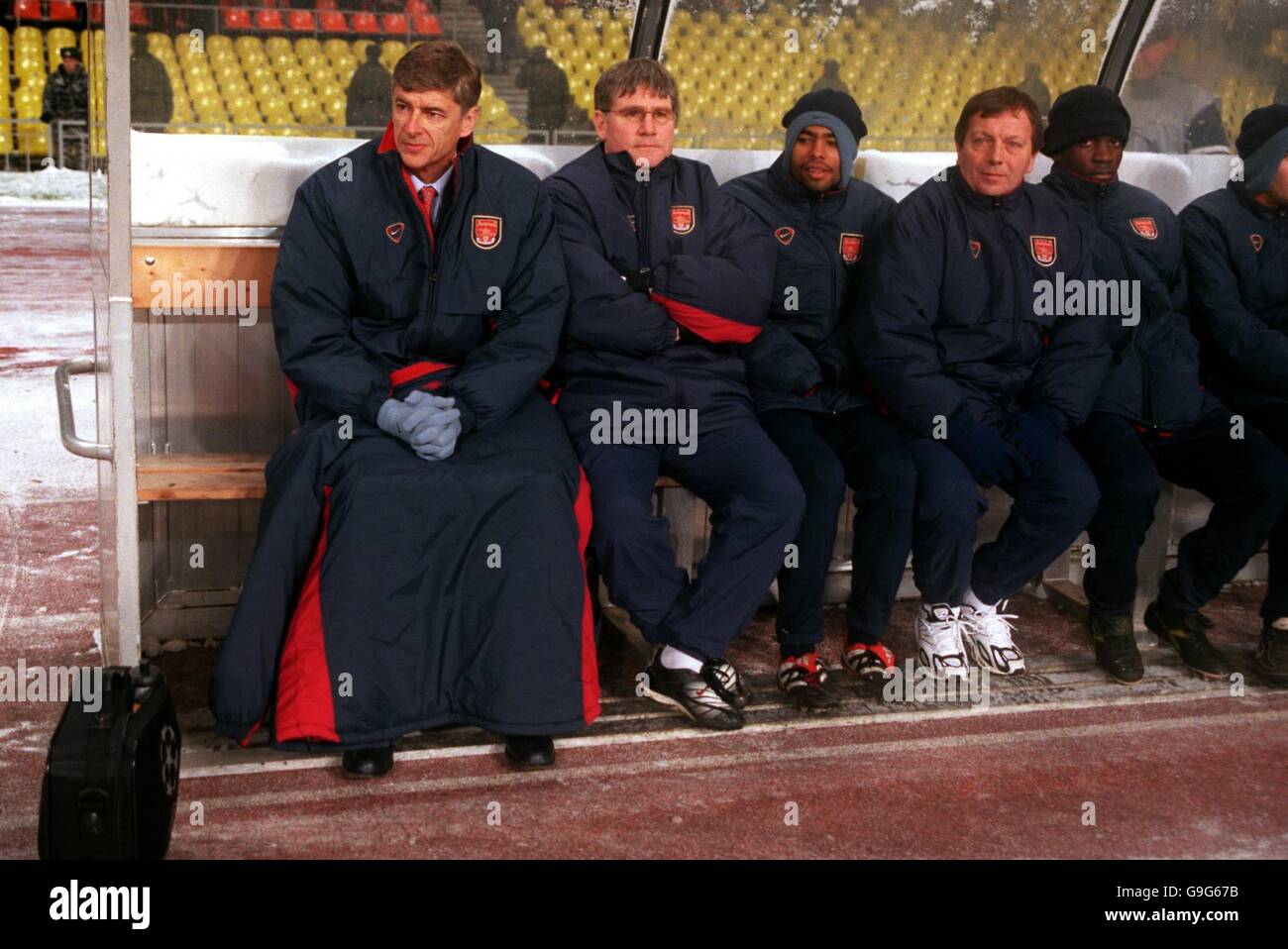 Arsenal manager keeps well wrapped up against the sub zero temperatures ...