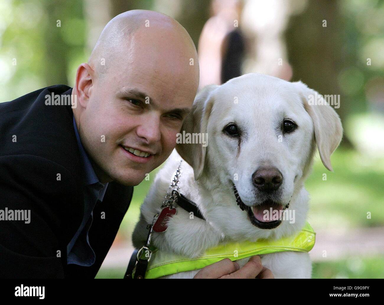 Larry, the golden retriever labrador cross with his owner Mark Pollock ...