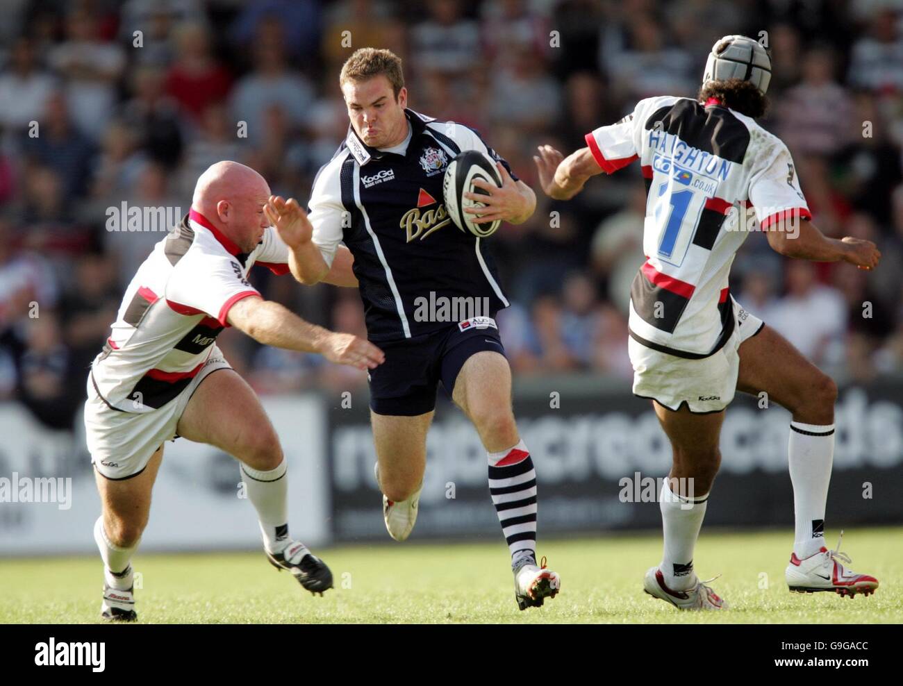 Bristol's Rob Higgins burst through Saracens' Matt Cairns (left) and ...