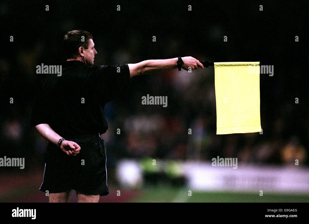 Linesman gives an offside decision hi-res stock photography and images ...