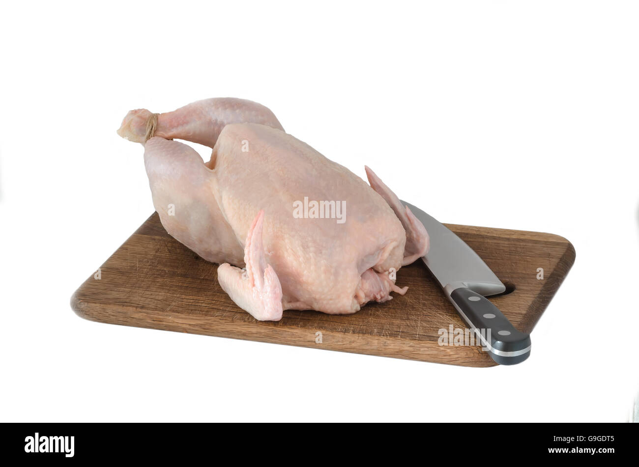 Raw chicken carcass on cutting board isolated on white Stock Photo - Alamy