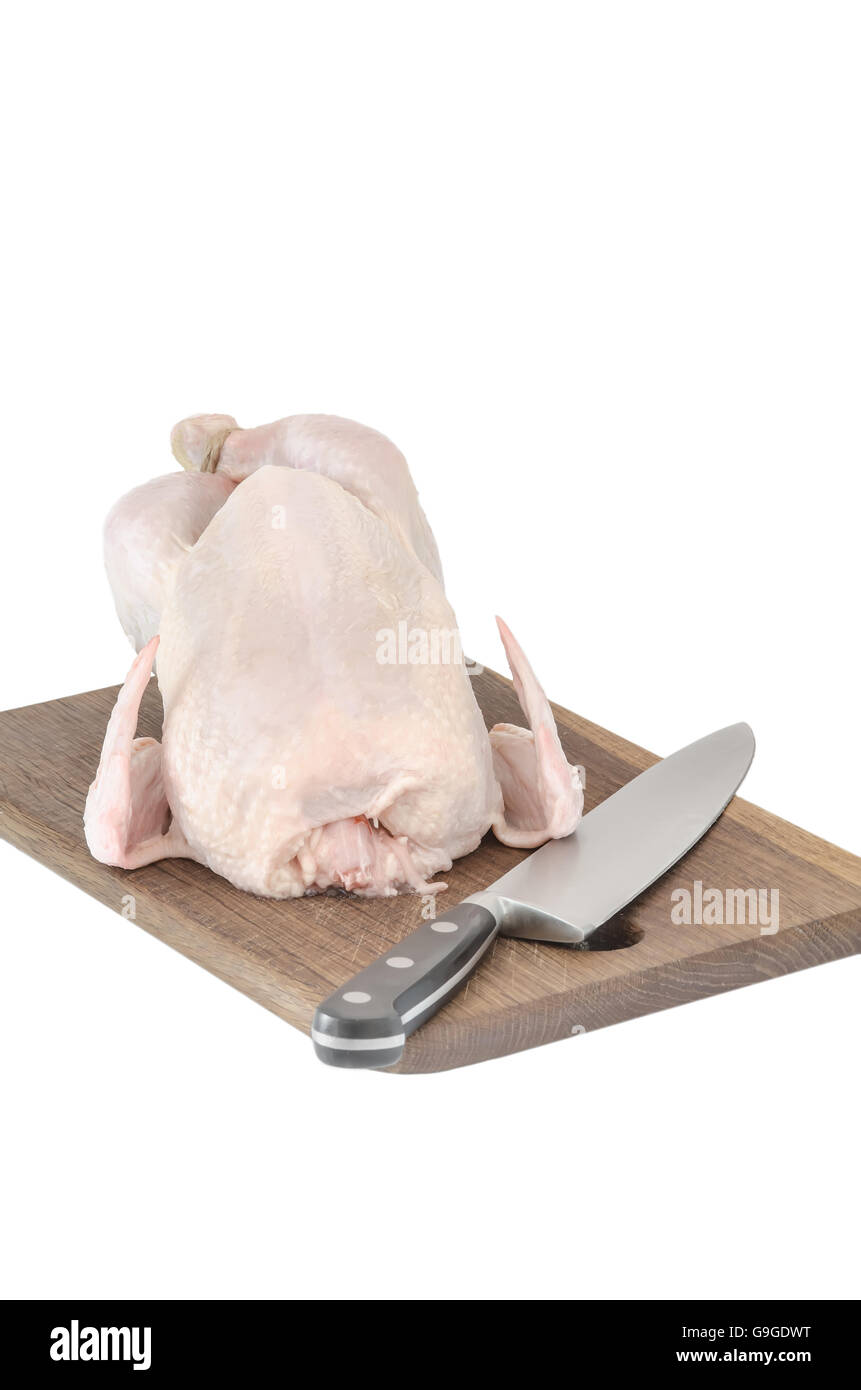 Raw chicken carcass on cutting board isolated on white Stock Photo - Alamy