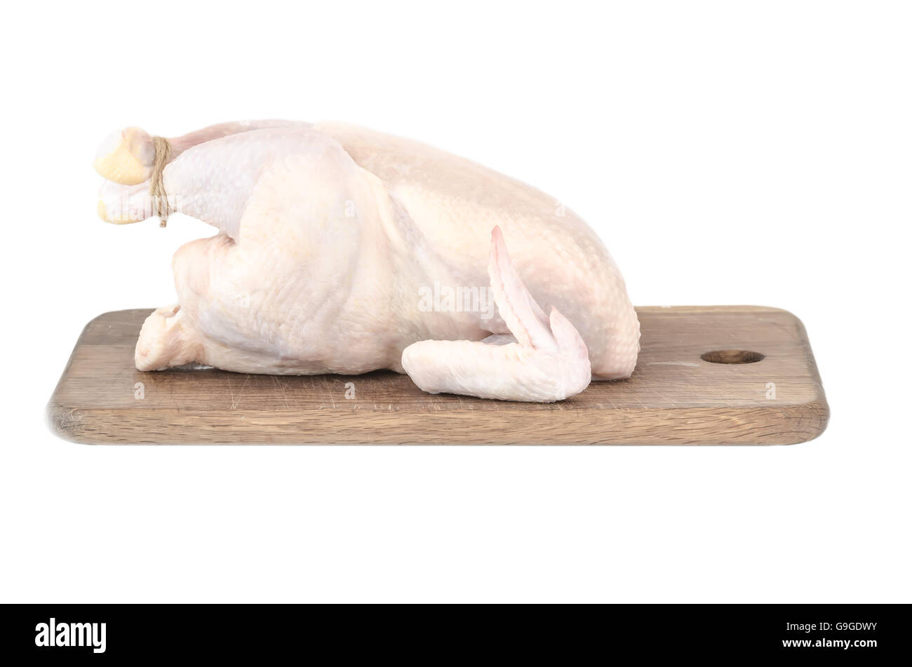 Raw chicken carcass on cutting board isolated on white Stock Photo - Alamy