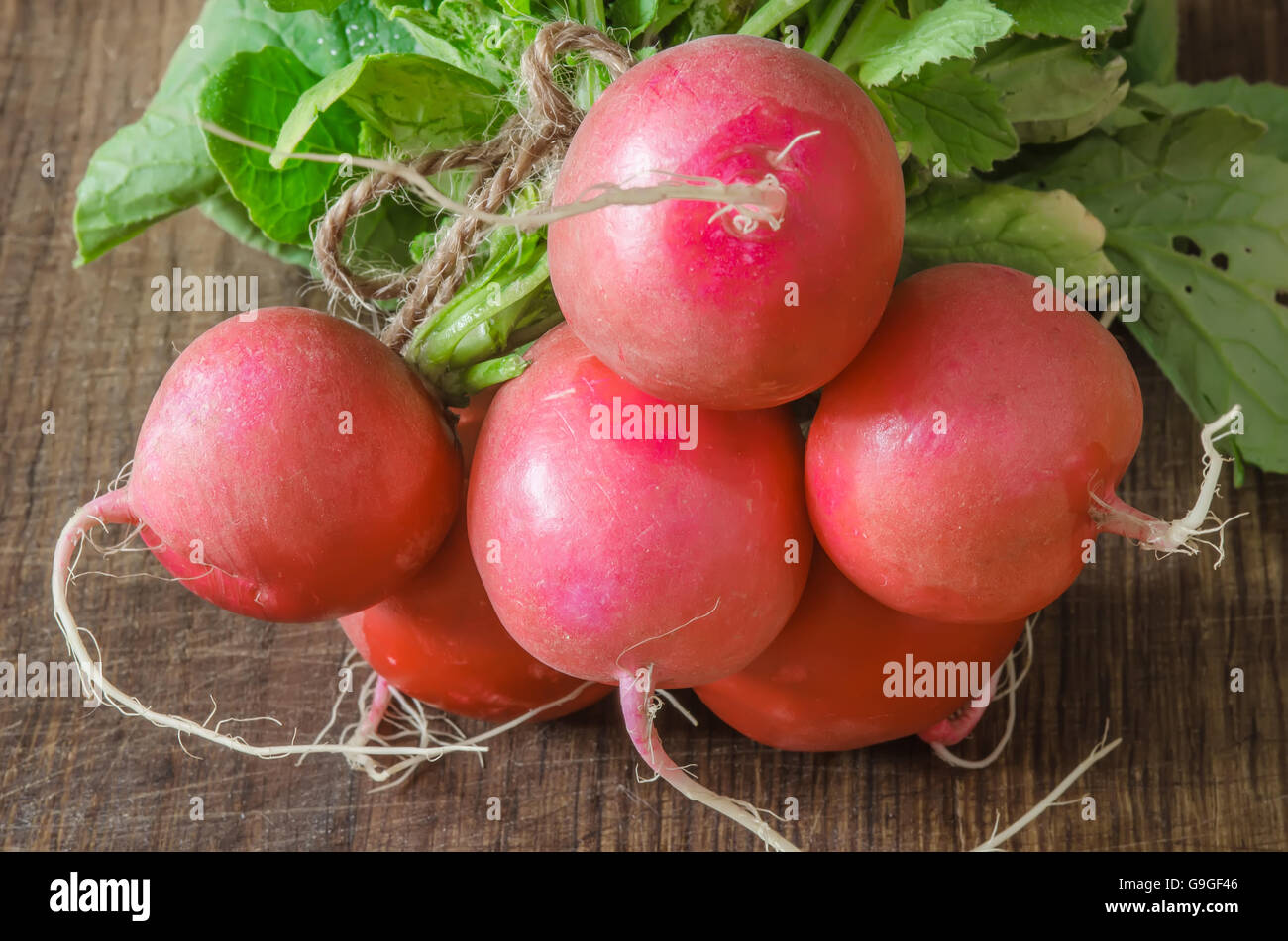 Beautiful organic radish on wooden background closeup Stock Photo - Alamy