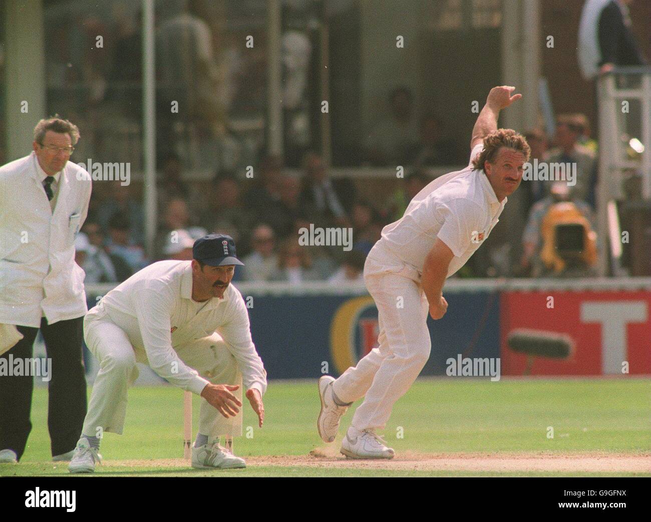 Cricket - Edgbaston. Ian Botham, bowling with Graham Gooch next to him ...