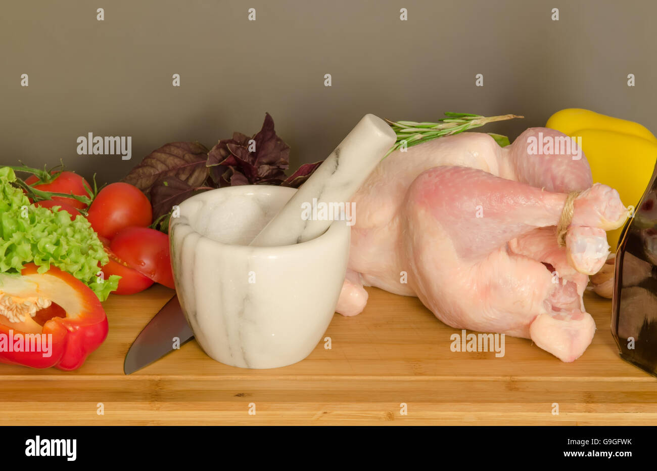 Row chicken with vegetables and spice on wooden table Stock Photo - Alamy