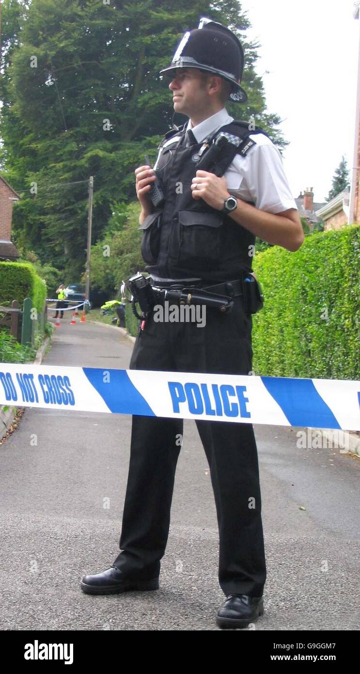 Police stand outside the ground floor flat where Mr Tamar and Miss ...