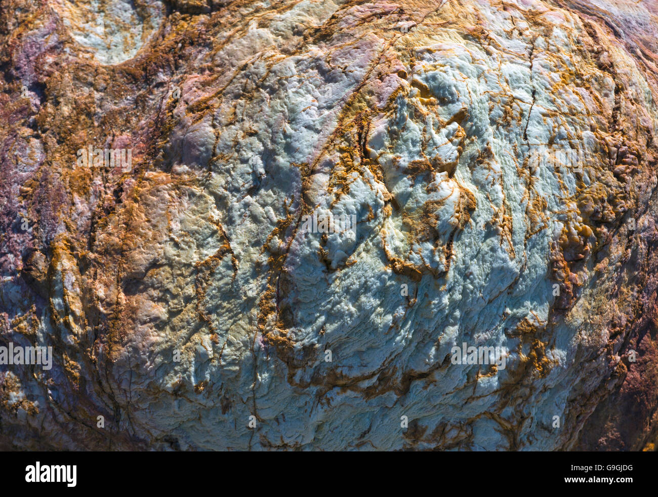 Geology showing some of the colourful rocks at Church Bay beach on the ...