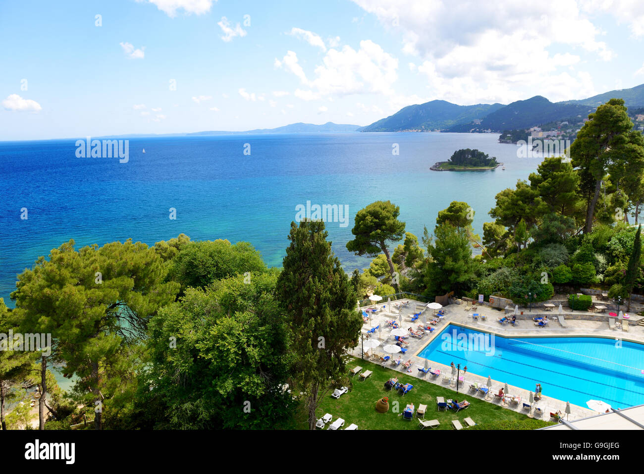 The beach and swimming pool and view on "Mouse island", Corfu island ...