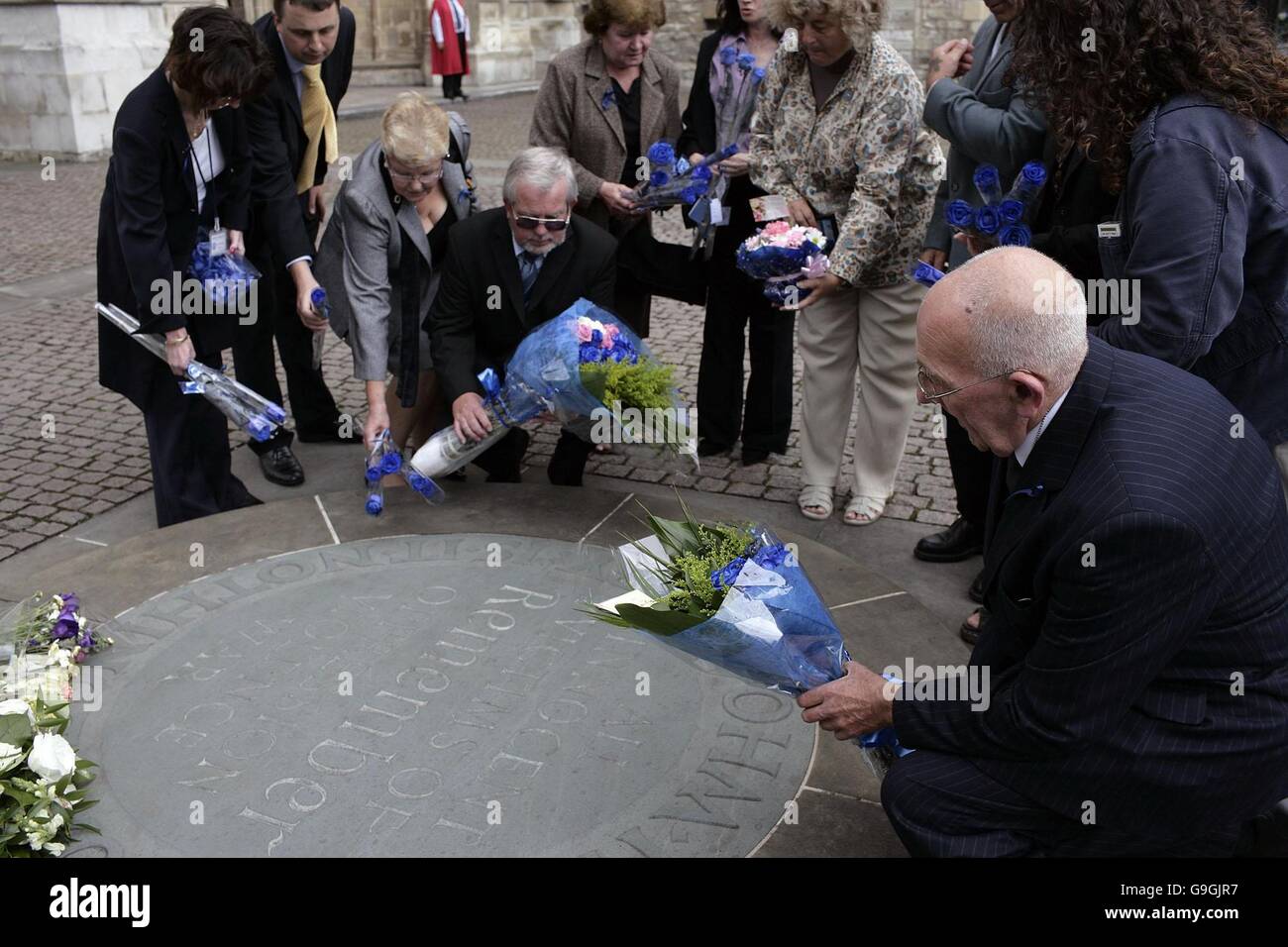 Neil Manser holds a flower for his father who fell victim to the MRSA ...