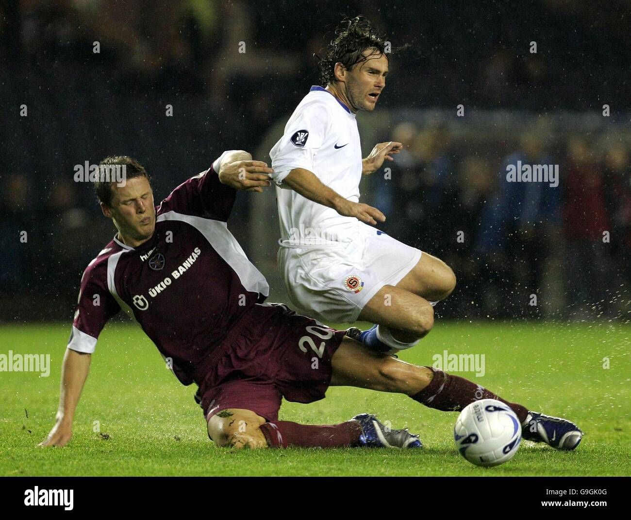 Heart's Christophe Berra challenges Sparta Prague's Karol Kisel during ...