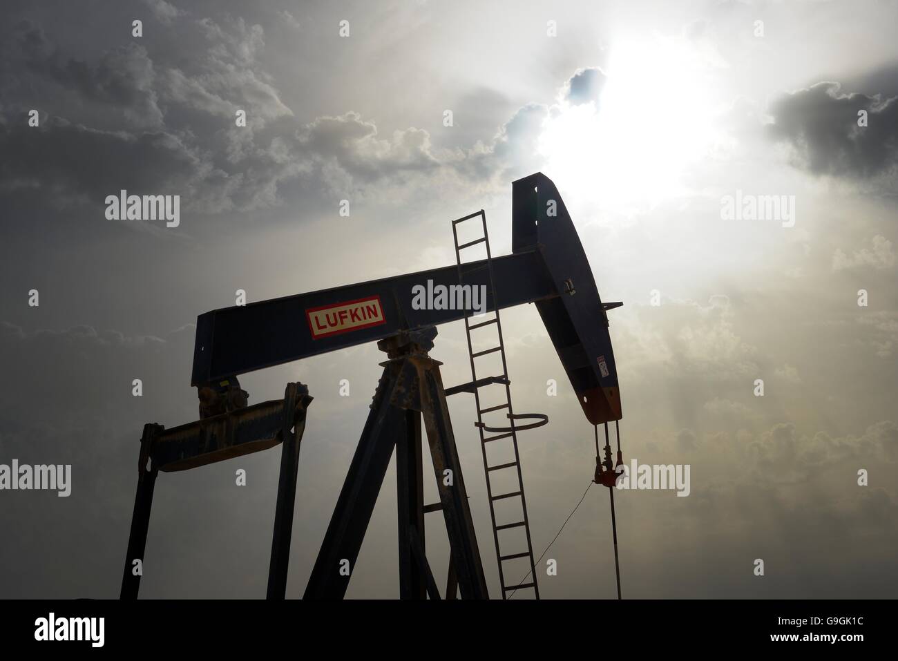 Pumpjack aka oil horse, nodding donkey, oil jack, beam pump raises ...